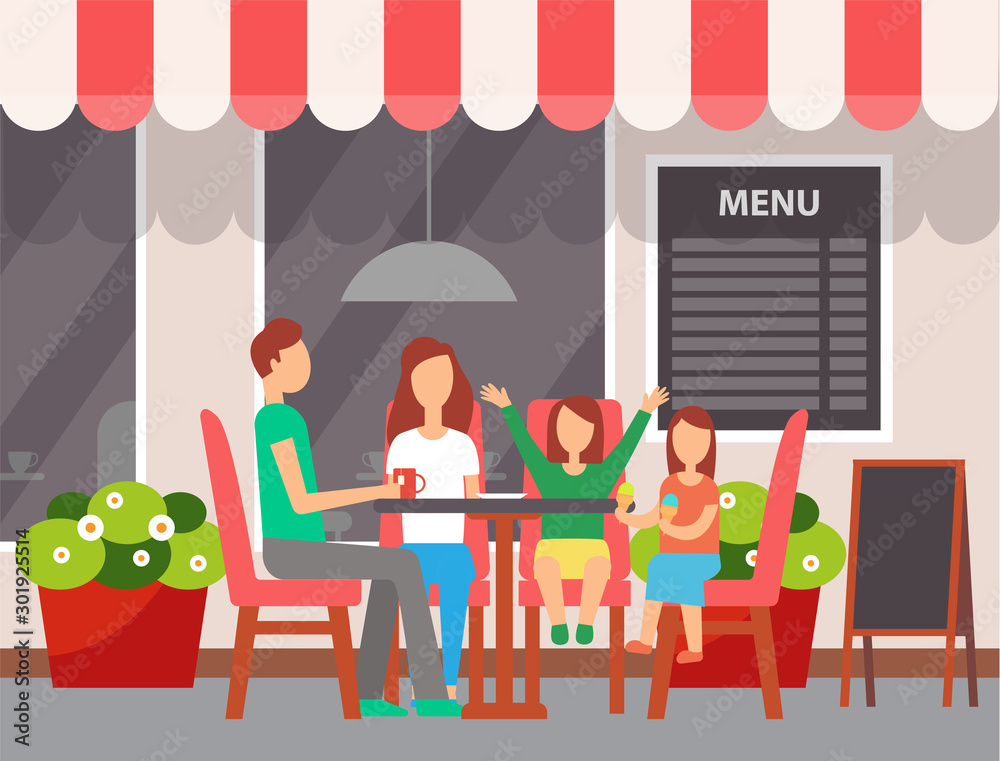 Happy Family Eating At Restaurant