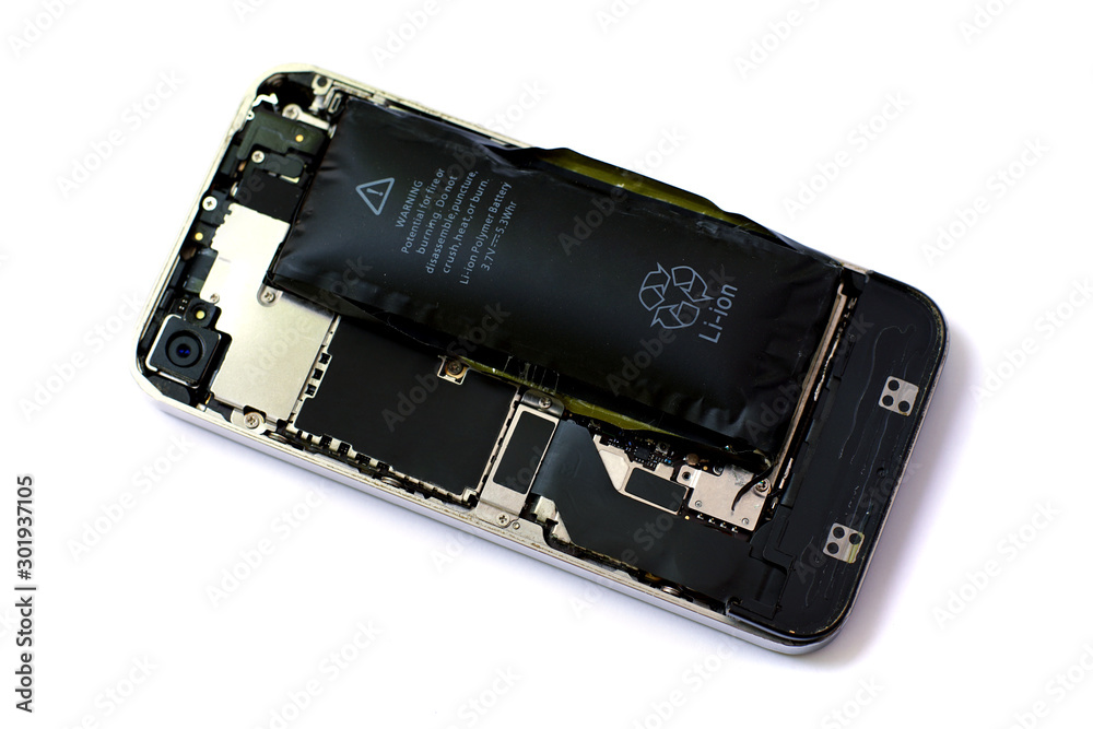 Swollen lithium ion polymer battery inside a mobile phone on white ...