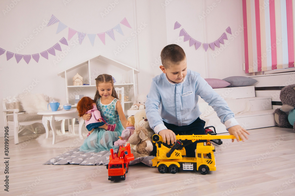 beautiful happy caucasian children playing in their room, boy playing ...