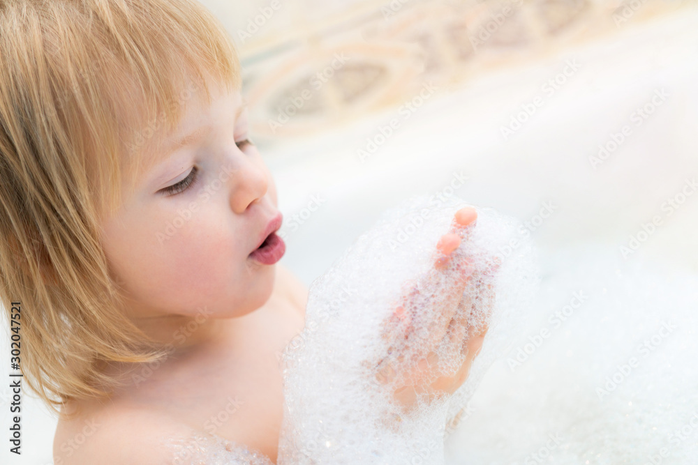 little girl bathes in a bubble bath. children love to swim Stock Photo ...