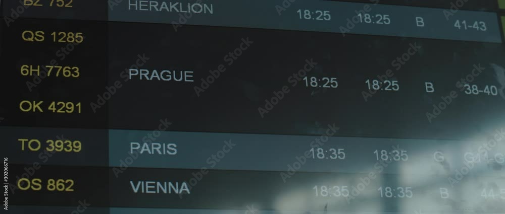 Flight status information changing on airport timetable screen ...