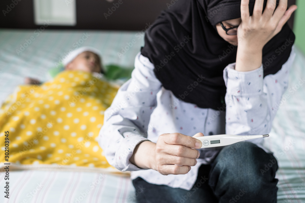 Stress and worried muslim mother wearing hijab call for emergency for ...