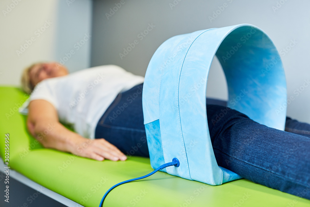 Patient receives magnetic therapy at the knee joint Stock Photo | Adobe ...