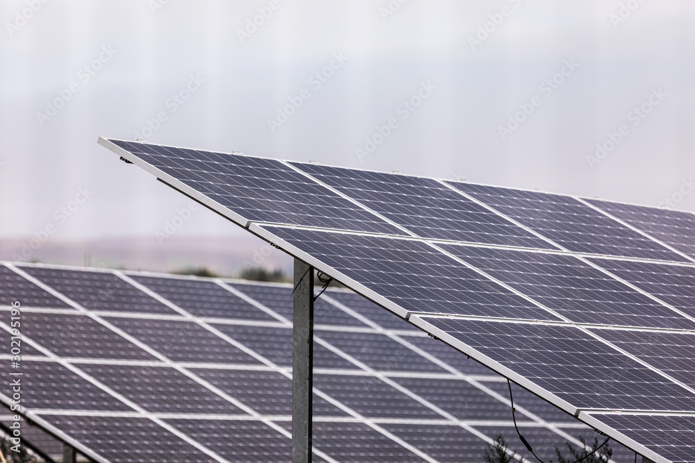 A power plant using renewable solar energy with the sun. Solar cells or ...