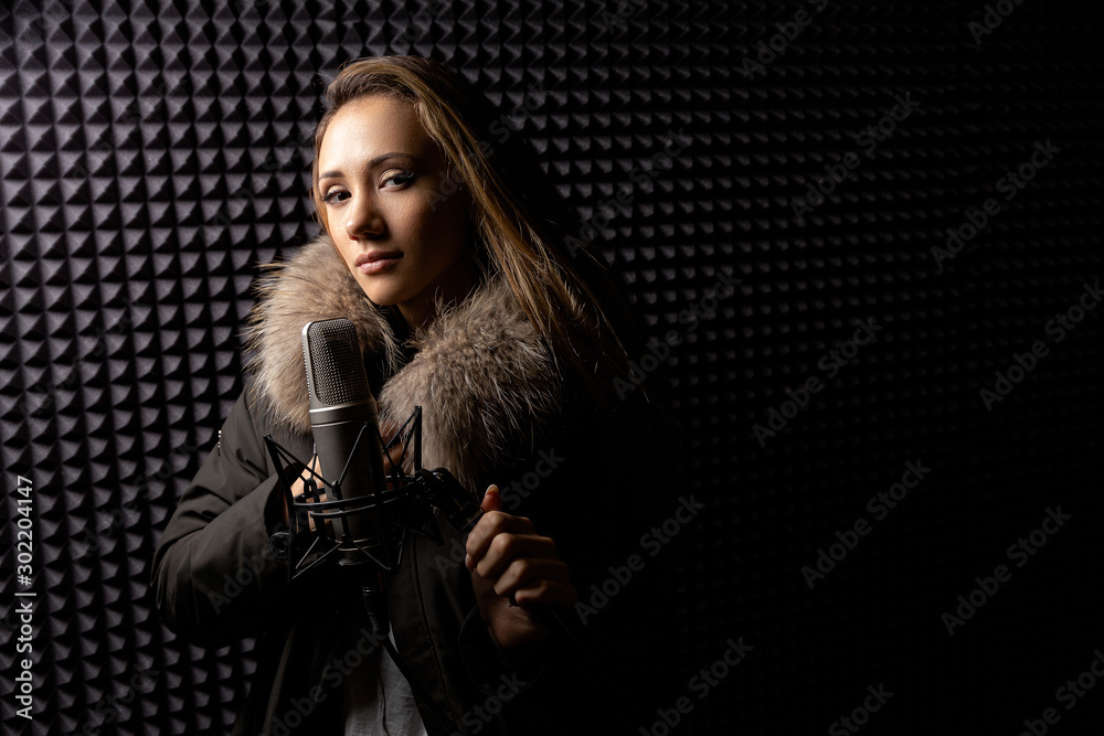 Female Vocalist In Recording Studio. Beautiful singer in the studio ...
