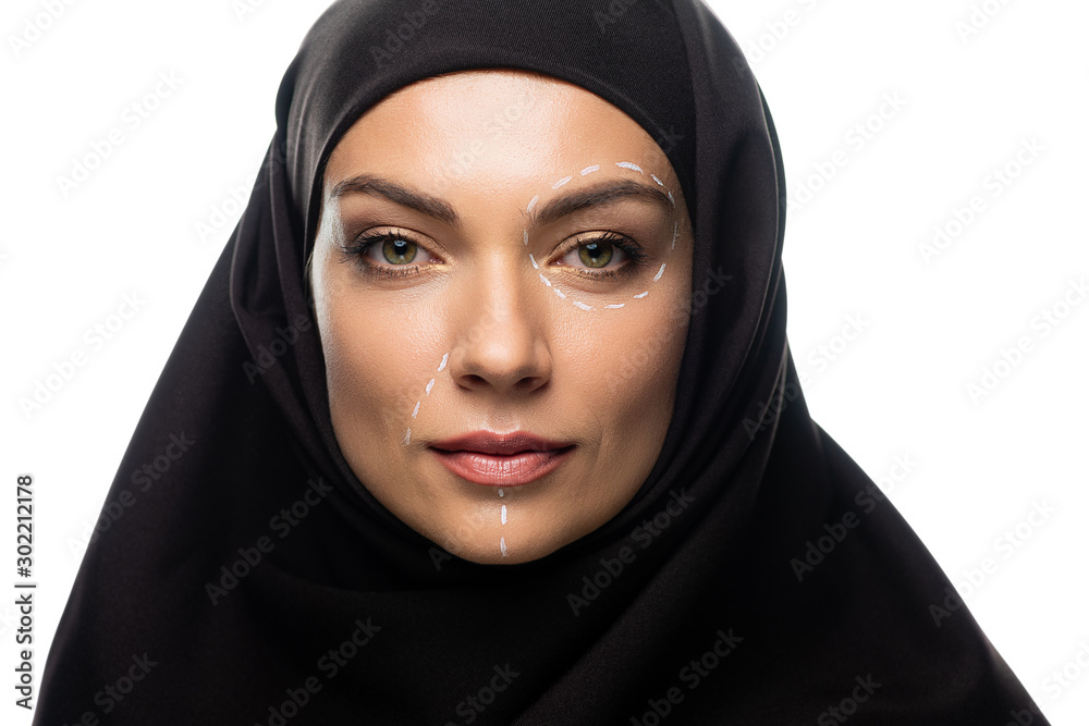 young Muslim woman in hijab having marks on face for plastic surgery ...