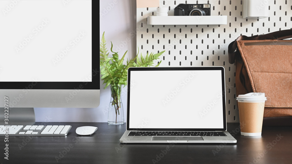Mockup laptop computer on office desk with peg board, Creative ...