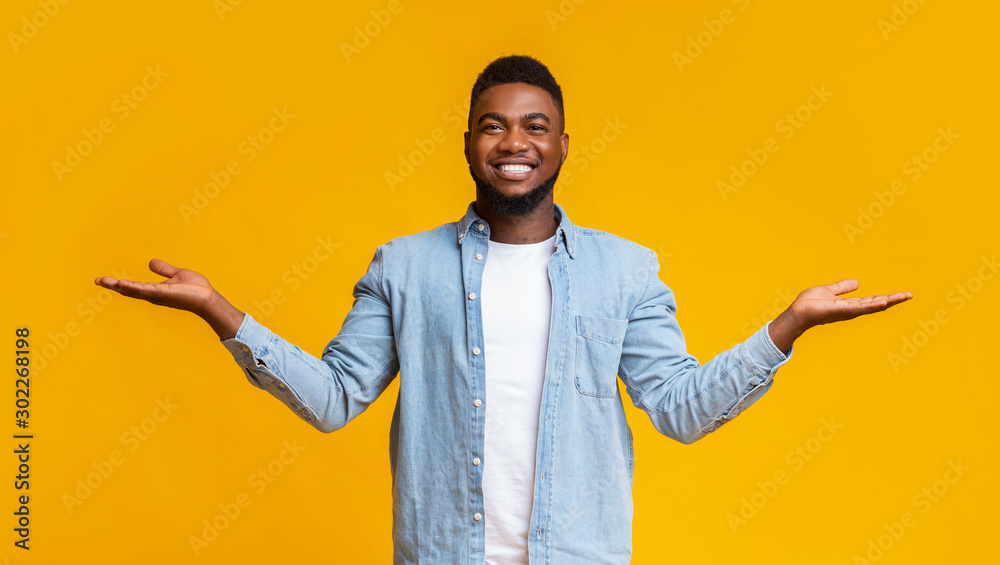 Black man making scales with his empty hands, comparing options Stock ...