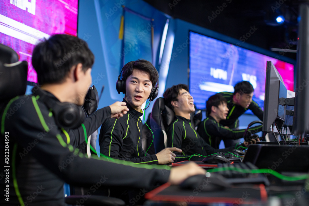 Young Chinese men playing esports Stock Photo | Adobe Stock