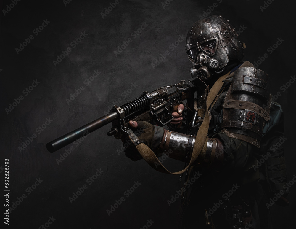 Man is wearing great costume of futuristic knight in gas mask and is ...
