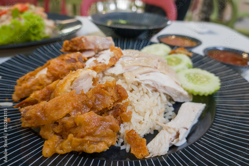 Hainanese chicken rice or "Kao Mun Kai" in Thai language mixing between ...