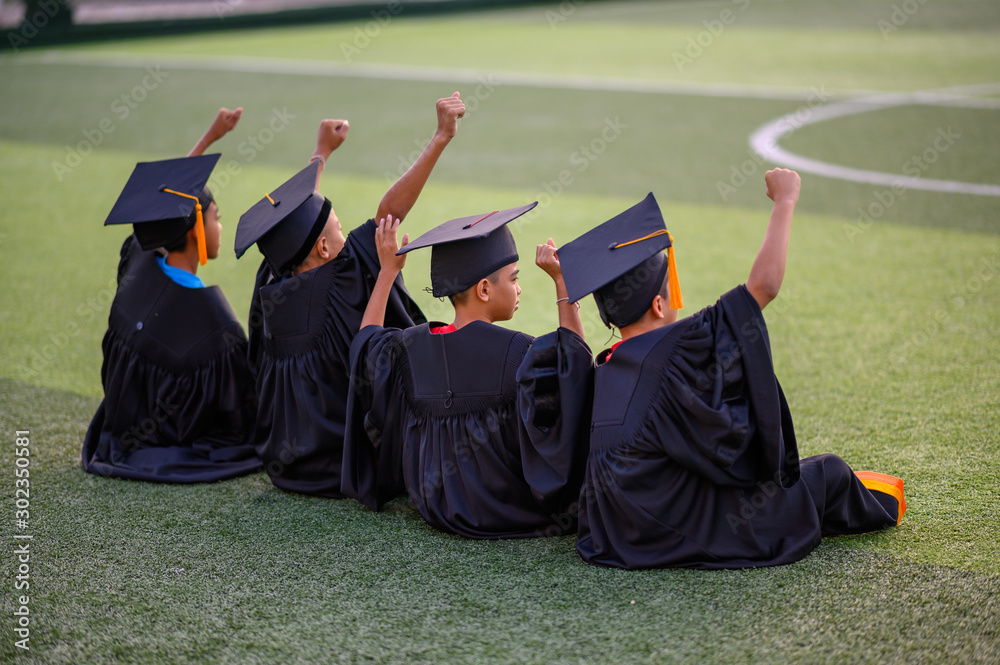 A group of boys are happy on their graduation day at school. Stock ...