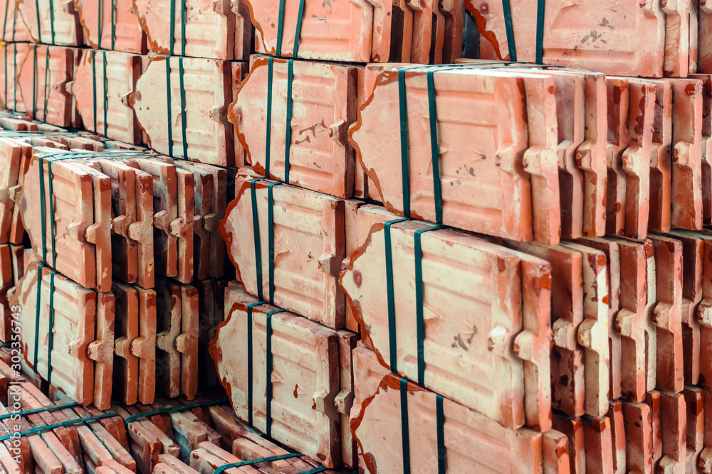 Close up to many pile of roof tiles traditional clay stack for a ...