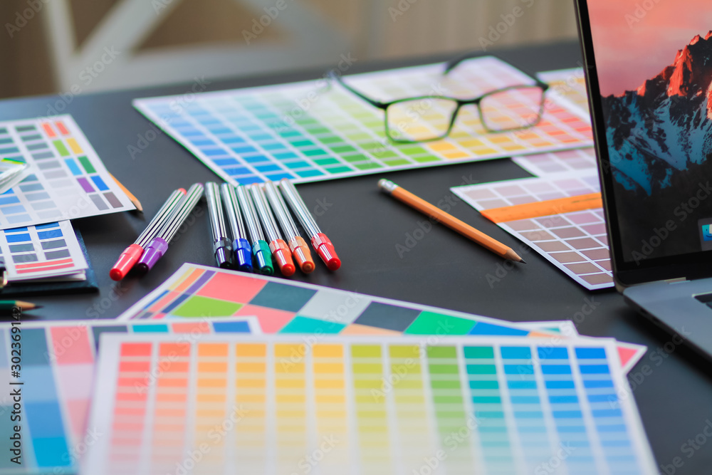 The equipment that is provided on the designer's desk in the office is ...