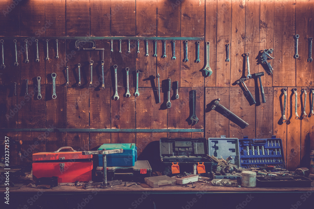 Workshop scene. Old tools hanging on wall in workshop, Tool shelf ...
