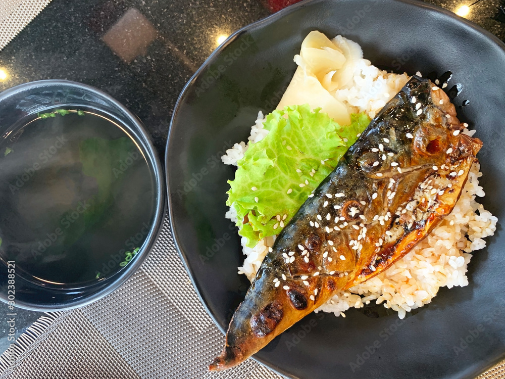 Grilled Saba with rice on topped rice bowl . traditional Japanese food ...