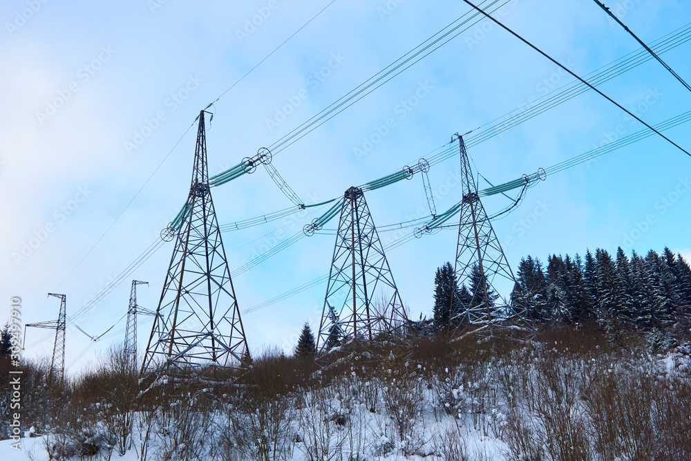 Transposition power transmission towers in snowy mountains. Glaciation ...