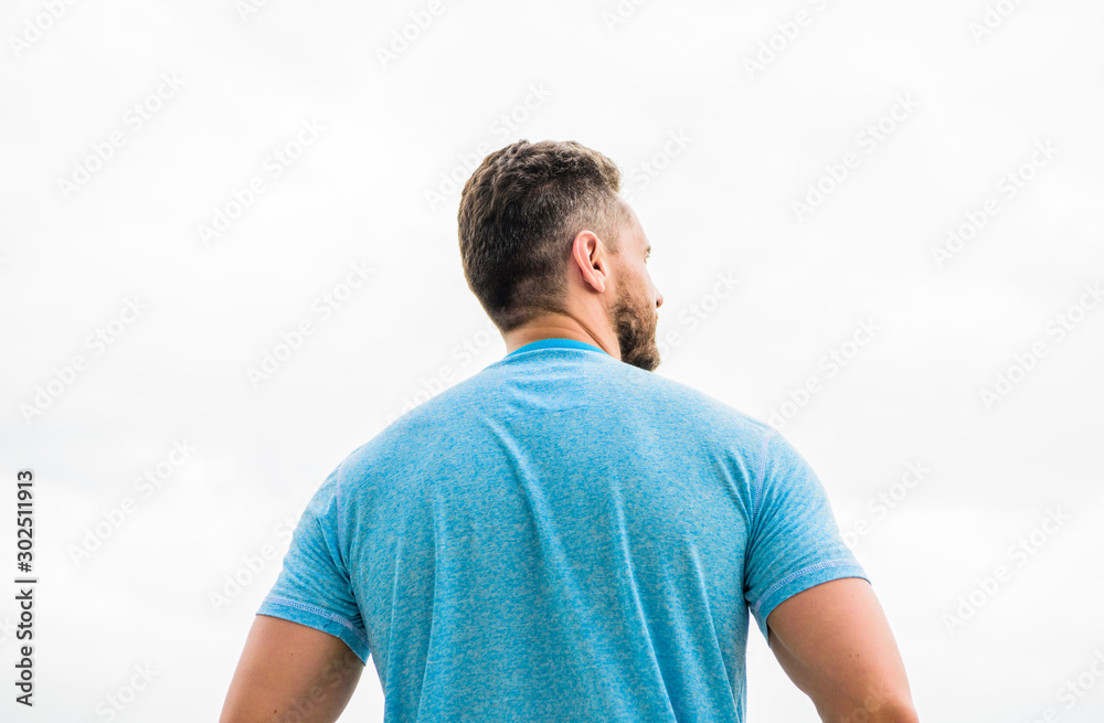 muscular back man isolated on white. searching for inspiration ...