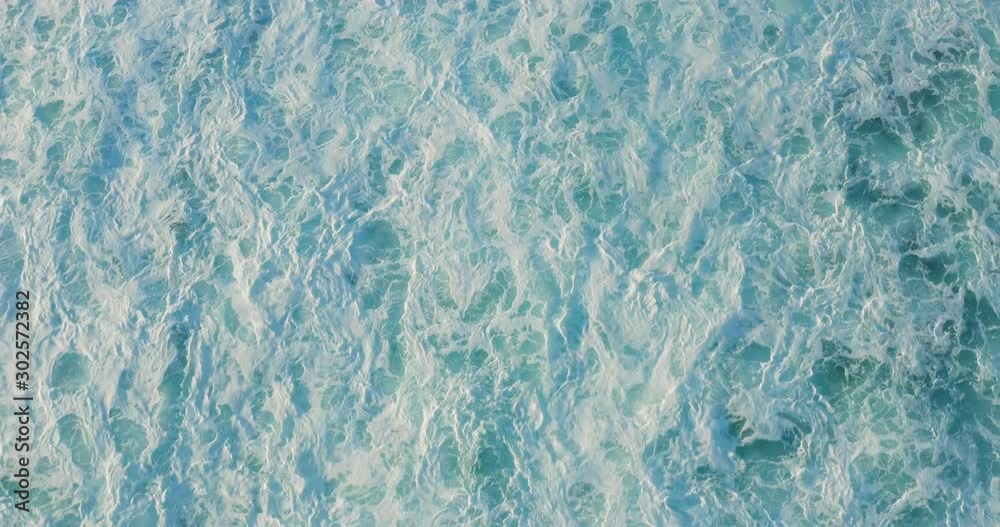 Aerial view of gurgling ocean churning and moving creating an ...