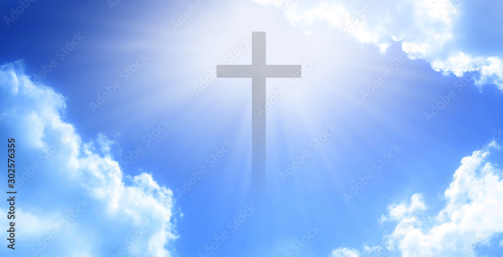 Christian cross appeared bright in the sky with soft fluffy clouds ...