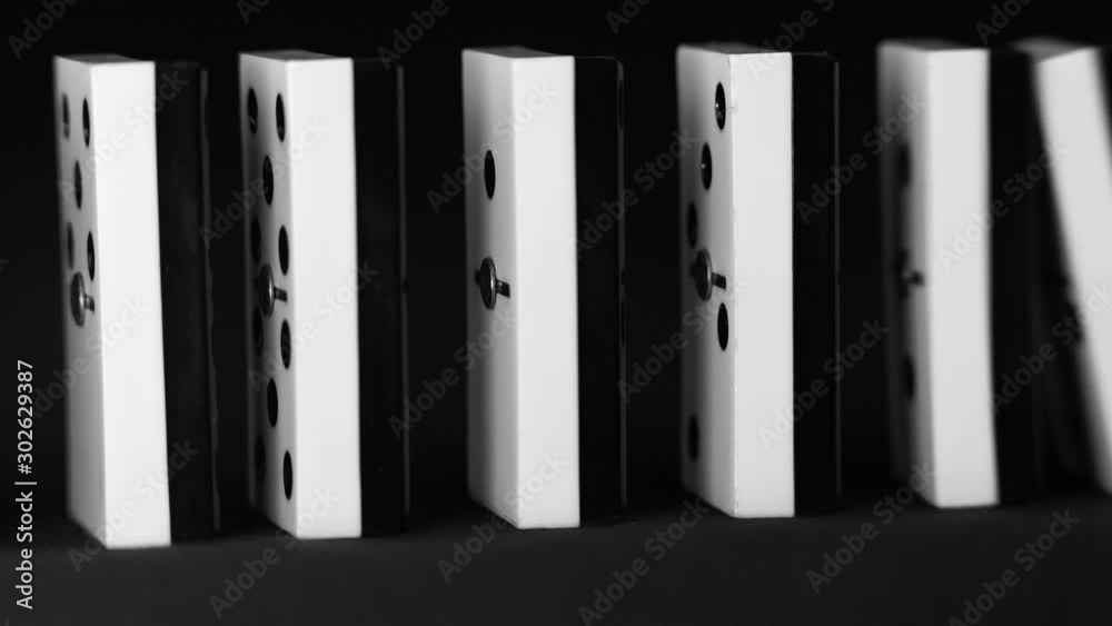 Domino effect. Row of white and black dominoes falling down. Chain ...