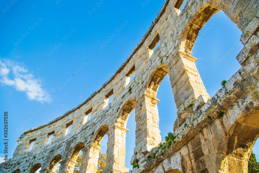 Ancient heritage in Pula, Istria, Croatia. Arches of monumental Roman ...