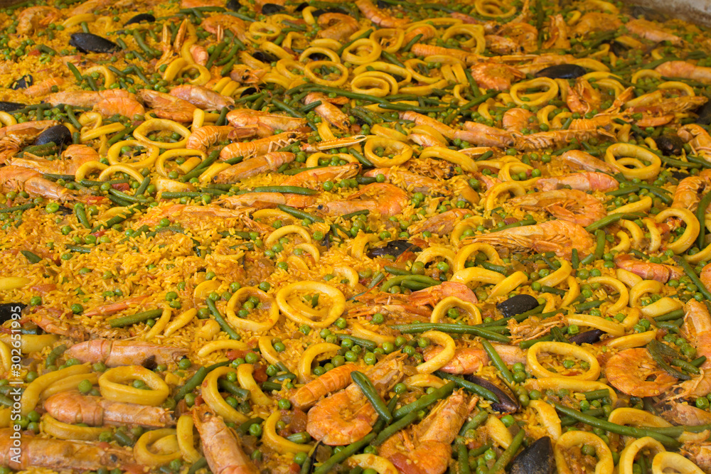 Paella traditional Spanish rice dish with seafood peas saffron bell ...