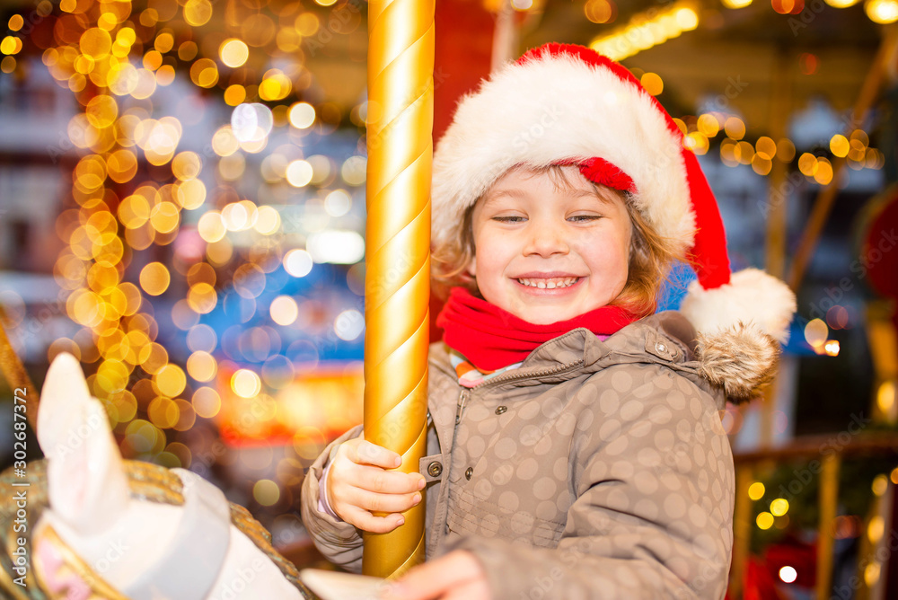 pretty young girl taking a ride in a carousel at christmas Stock Photo ...