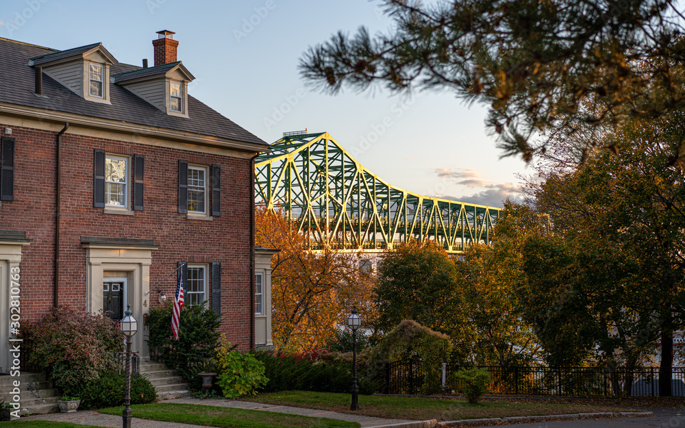 Brick house and american flag, background Maurice J. Tobin Memorial ...
