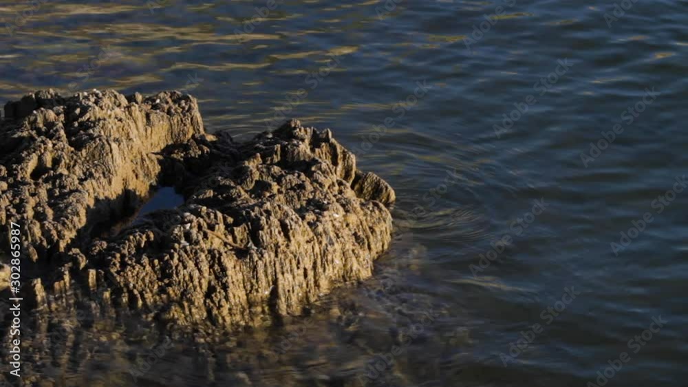 Lake Pleasant water laps up against a rocky formation of arkosic sand ...