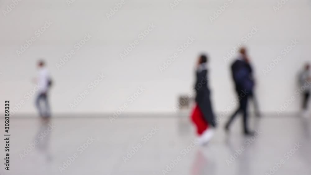 Blurred crowd of people walking by in a hallway Stock Video | Adobe Stock