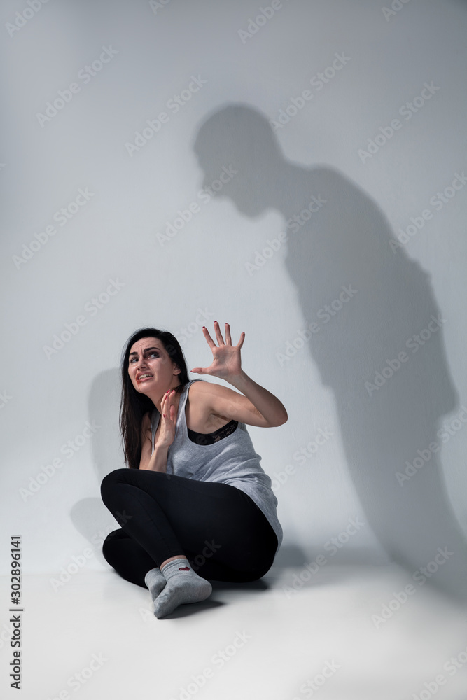 Foto de Woman in fear of domestic abuse, violence, concept of female ...