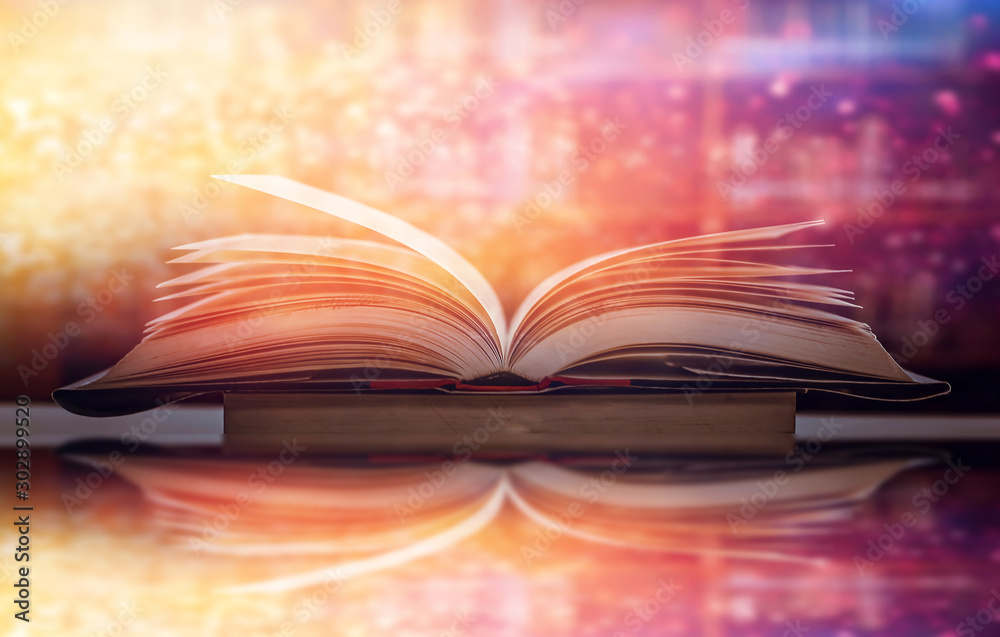 Book stack in the library room and blurred bookshelf for business and ...