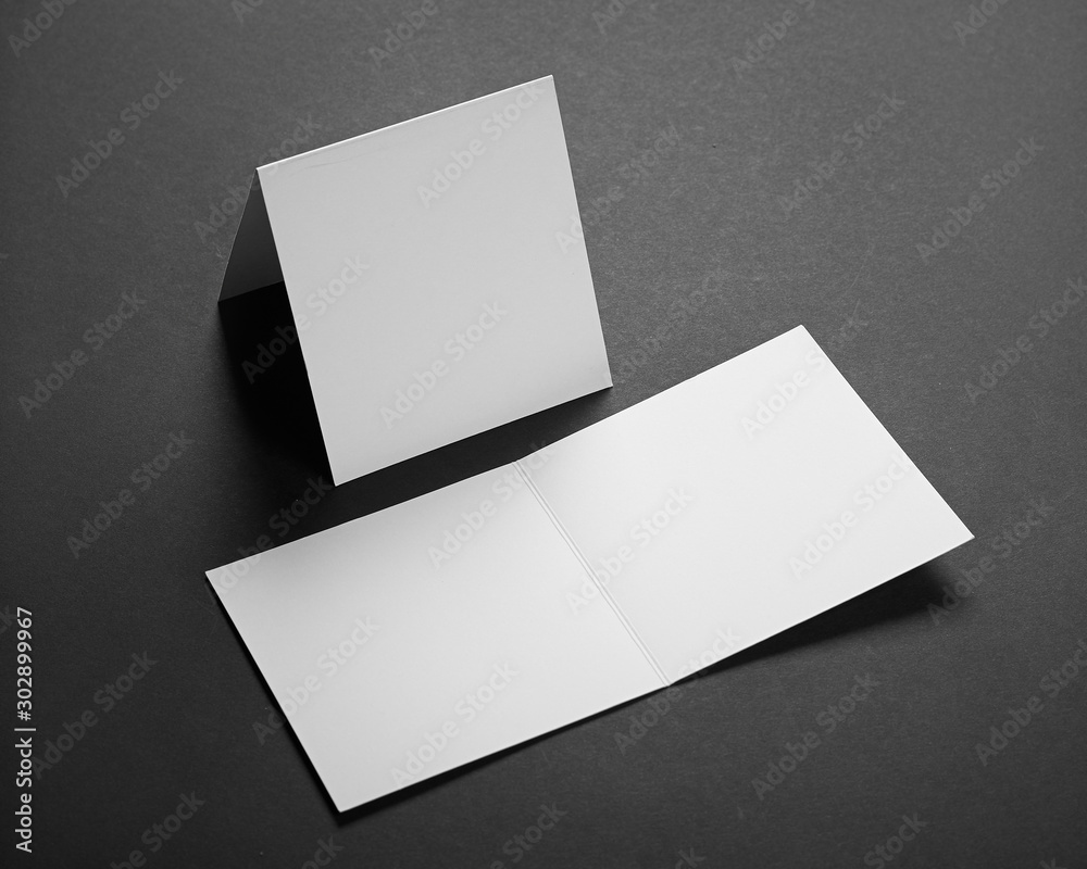 Square postcard mock-up on black paper background Stock Photo | Adobe Stock