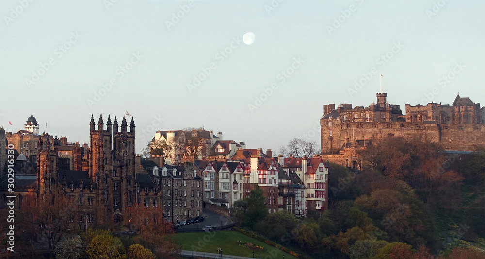 Sunrise over Edinburgh Castle. The first sun rays hit the iconic ...
