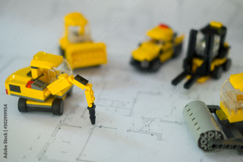 Car toys transport construction on architectural project, construction ...