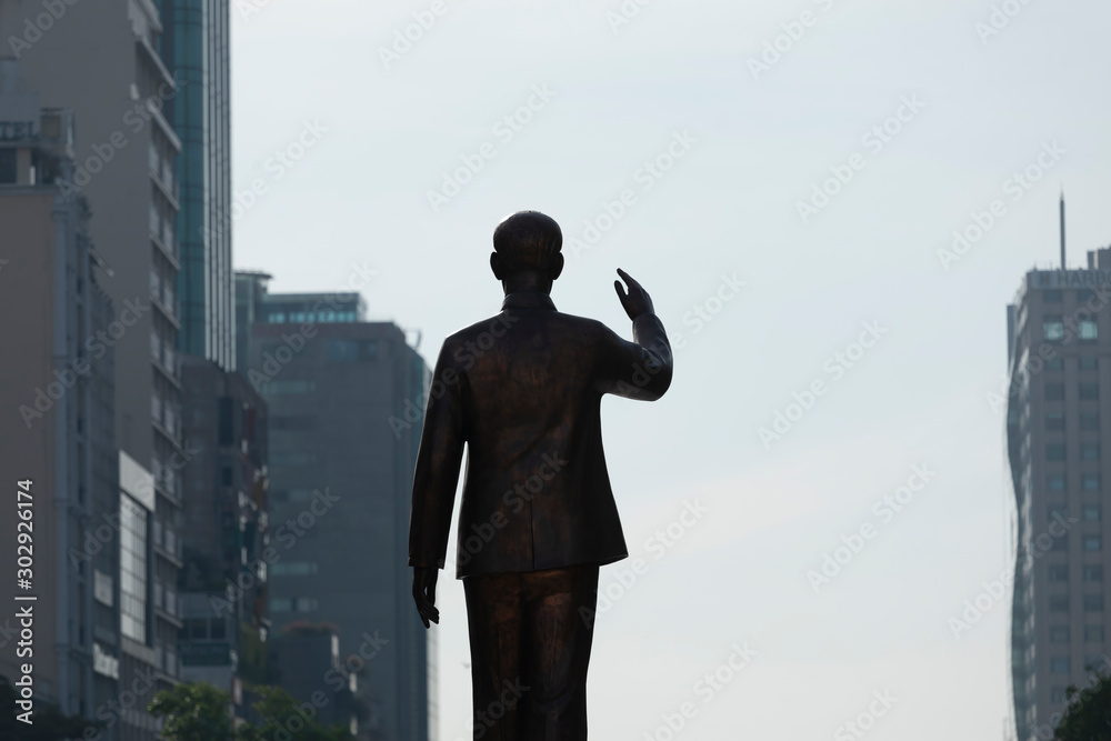 Recently polished bronze statue of Ho Chi Minh standing in the famous ...