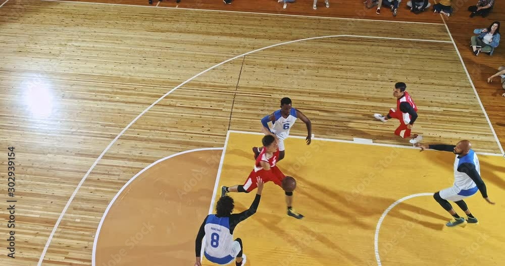 Drone footage of basketball players on big professional arena during ...