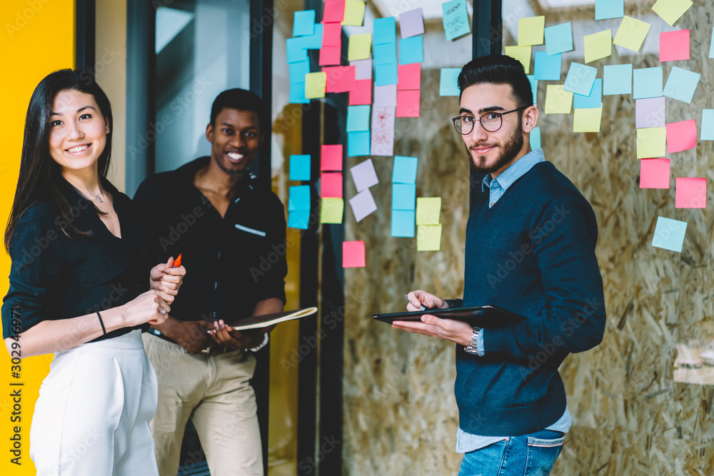 Portrait of happy group of diversity employees office looking at camera ...
