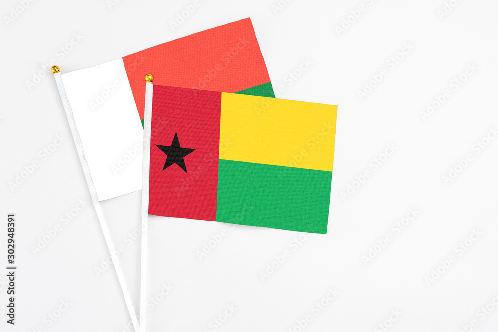 Guinea Bissau and Madagascar stick flags on white background. High ...