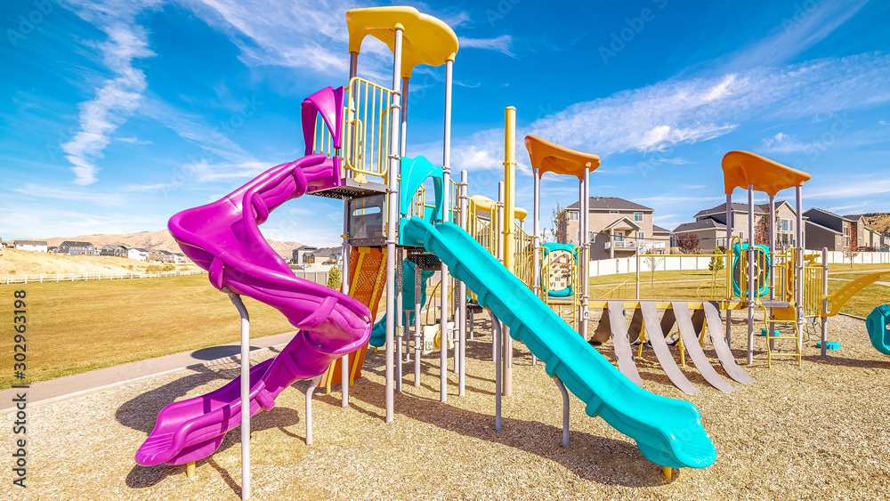 Panorama Colorful blue and purple slides in kids playground Stock Photo ...