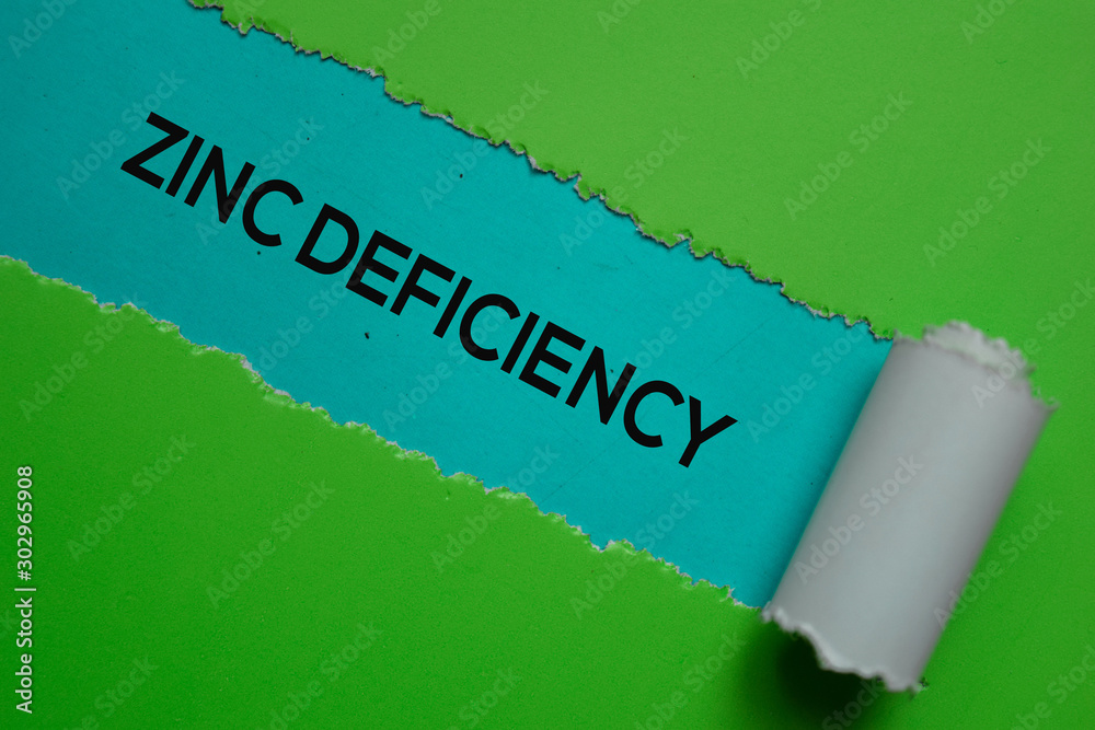 Zinc Deficiency Text written in torn paper. Medical concept Stock Photo ...
