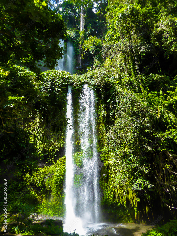 A stunning two levelled waterfall in Lombok, Indonesia. Tiu Kelep ...
