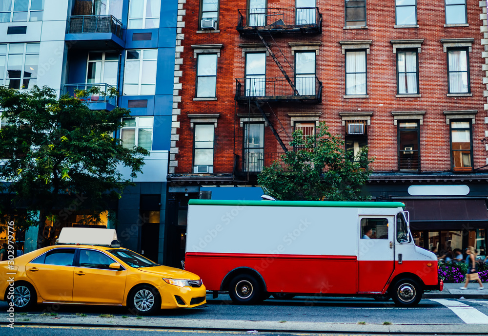 Van automobile on avenue in district with vintage buildings ...