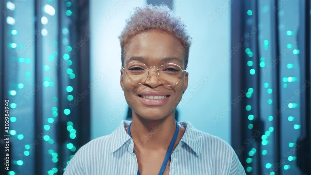Attractive positive african female IT specialist wearing glasses ...