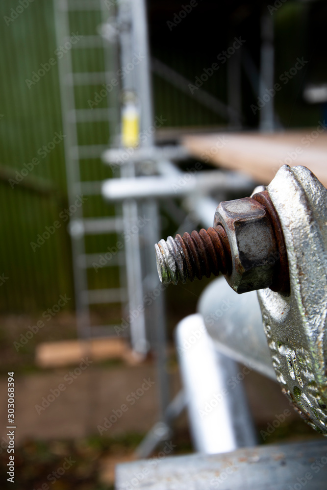 Galvanised steel scaffolding coupling connection on construction site ...