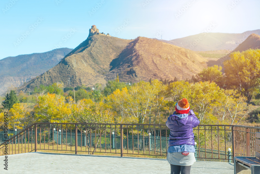 Asian backpacker woman in winter suit with camera take photo of view of ...