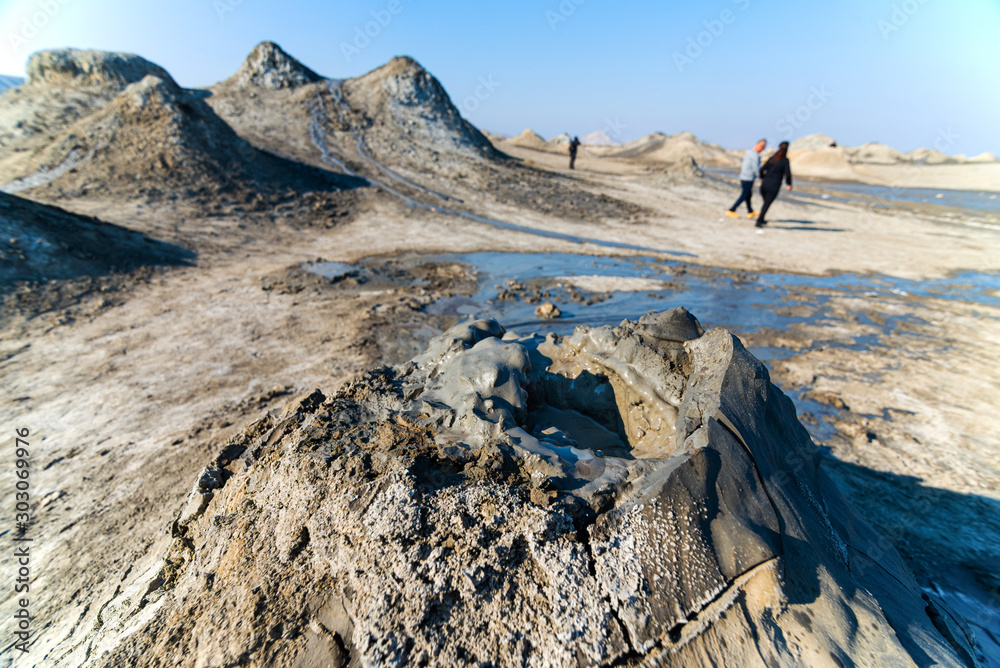 Mud volcano with tourist in background in gobustan national park ...