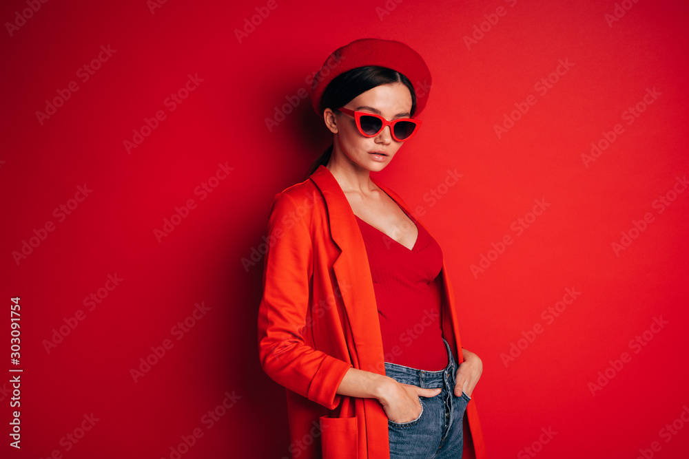 Serious, calm and peaceful young woman posing on camera. Slim model in ...
