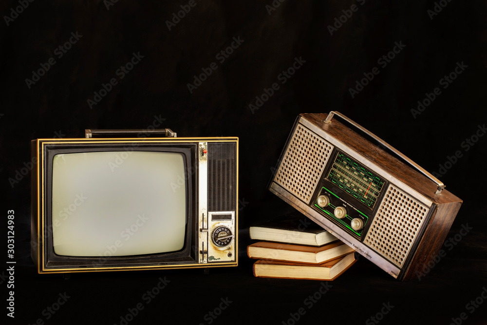 Vintage old TV with retro transistor receiver radio Stock Photo | Adobe ...